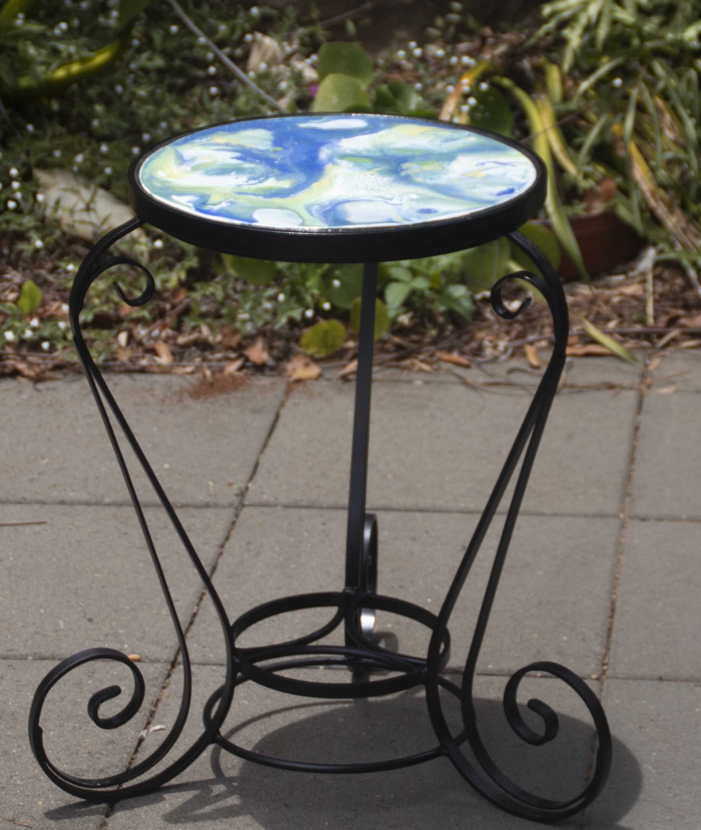 Wrought iron table with marbled ceramic top